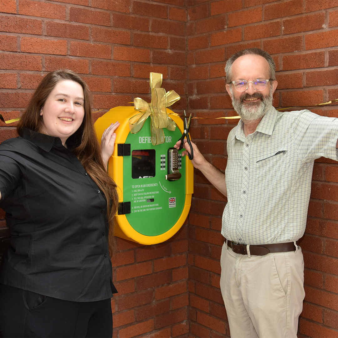 Community comes together to install life-saving defibrillator - Housing ...